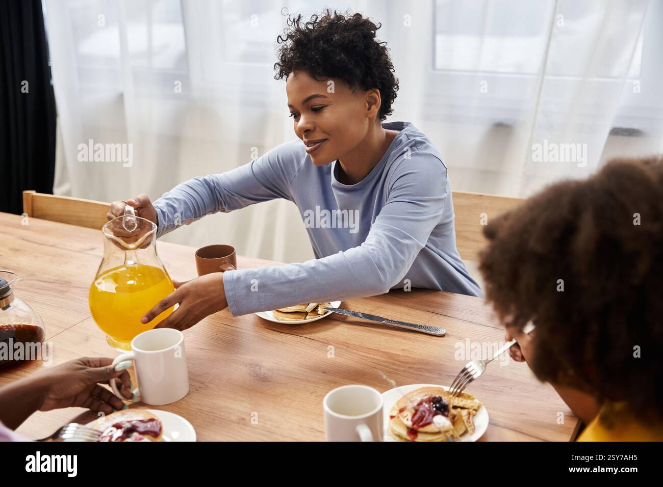 A joyful breakfast gathering highlights family bonding and love in a ...