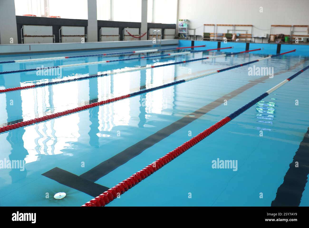 Swimming pool with clean water and lane dividers indoors Stock Photo ...
