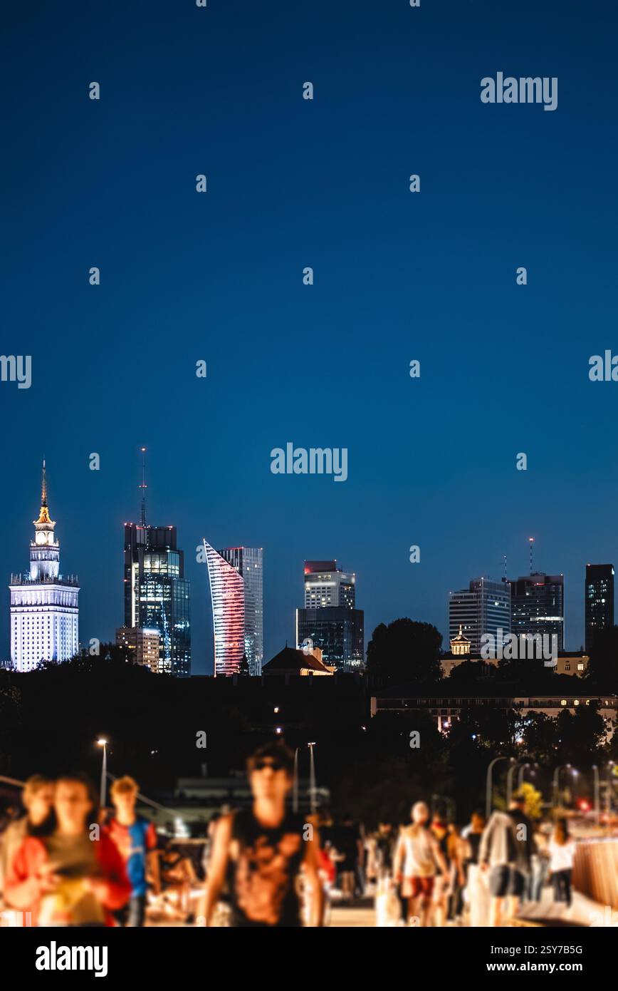 night over skyline of Warsaw city with skyscrapers and downtown ...