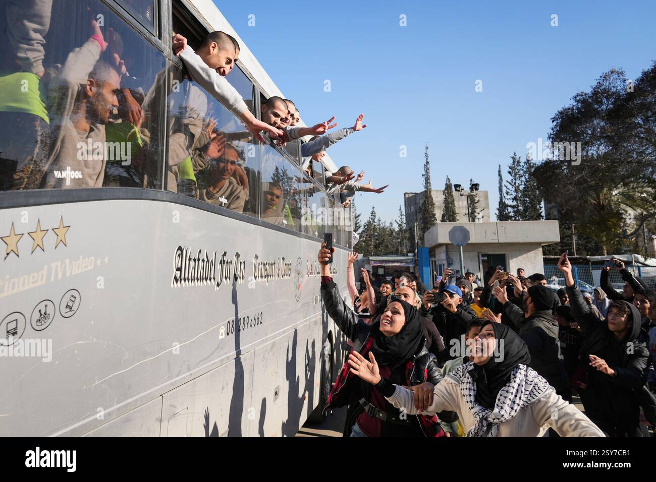 Freed Palestinian detainees are greeted after being released from an ...