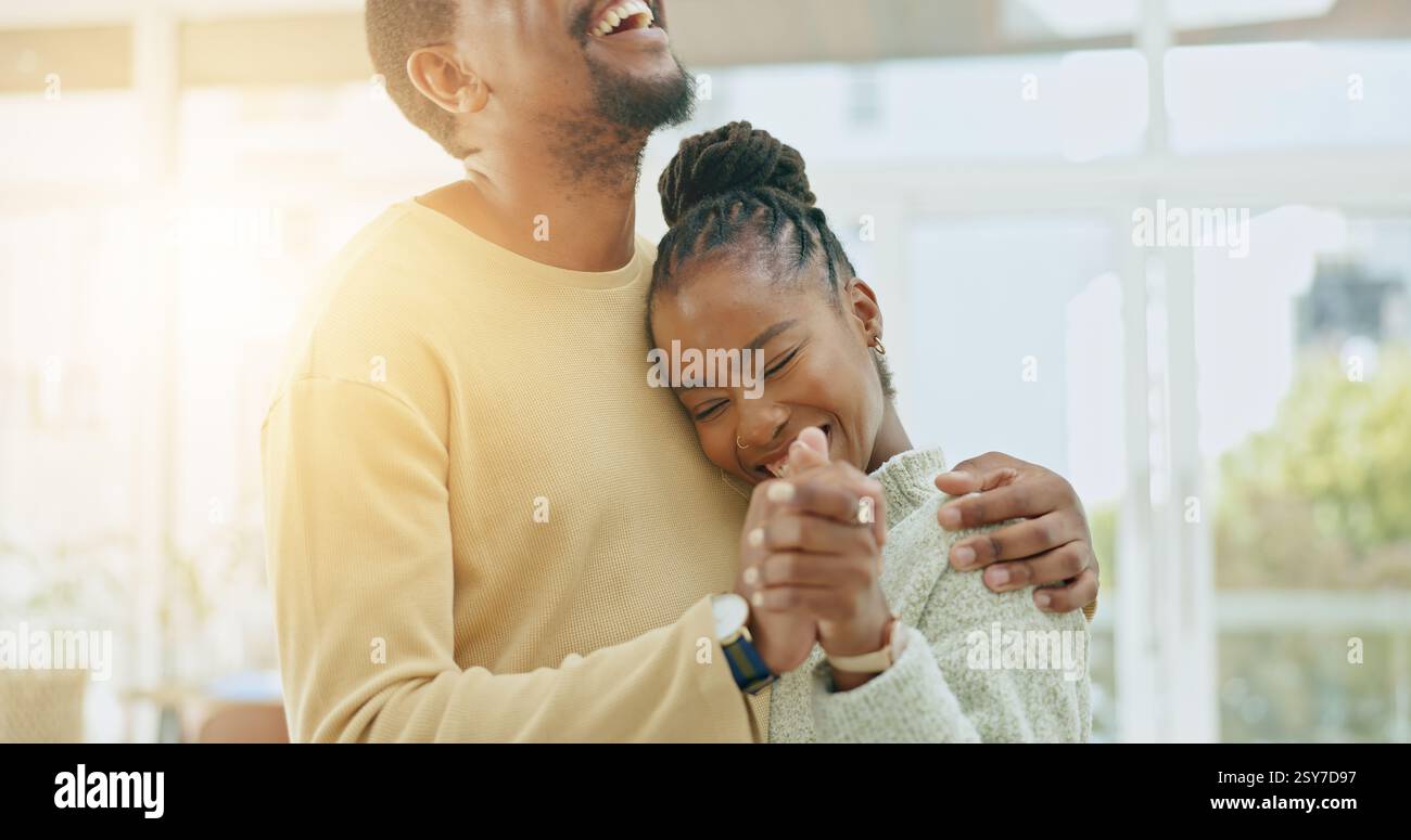 Black couple, dance and hug in home together with love, care and ...