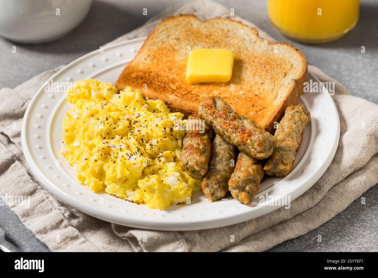 Healthy Homemade American Scrambled Egg Breakfast with Sausage and Toast Stock Photo - Alamy