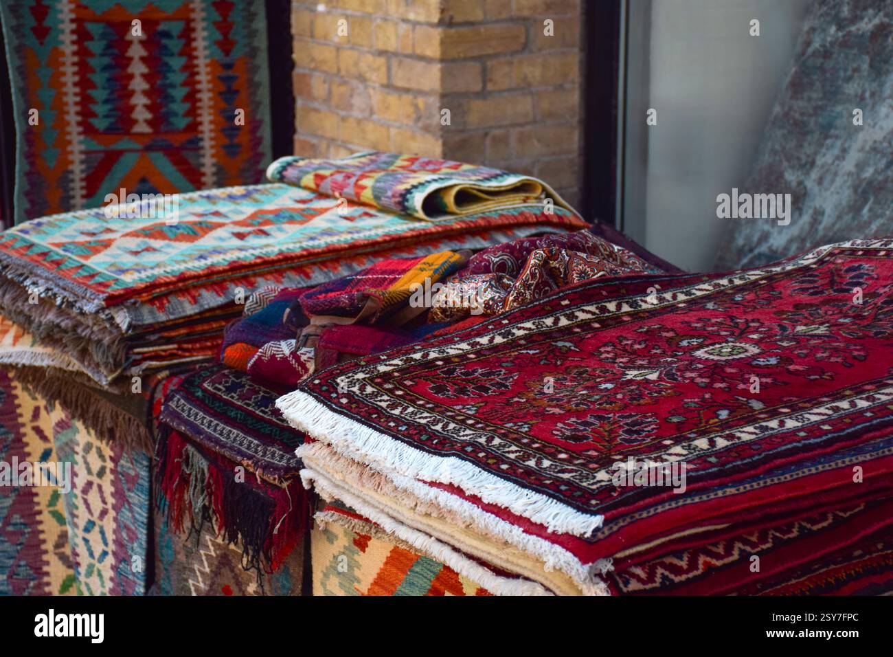A display of Persian rugs in front of a retail store Stock Photo - Alamy
