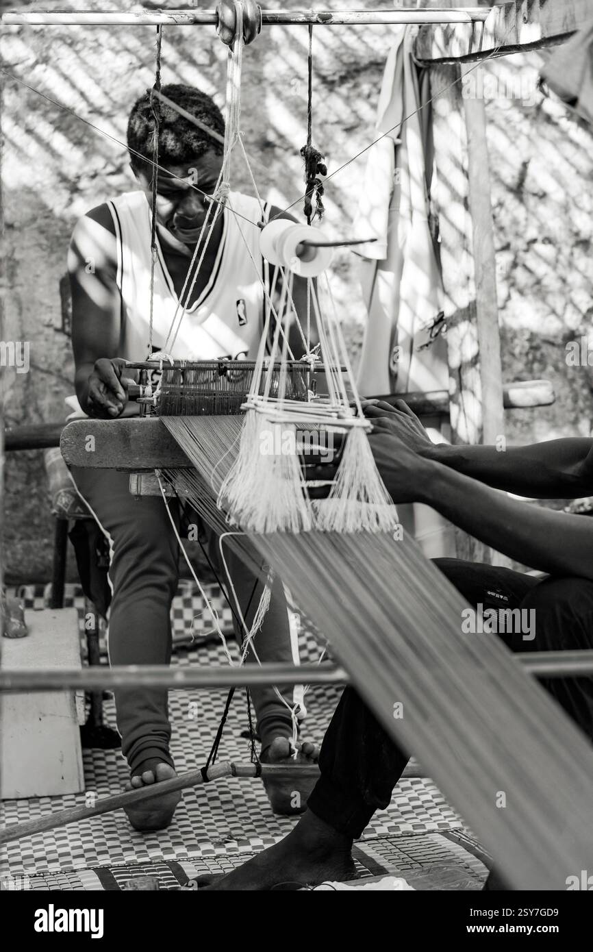 African men working at weaving machine in the village Stock Photo - Alamy