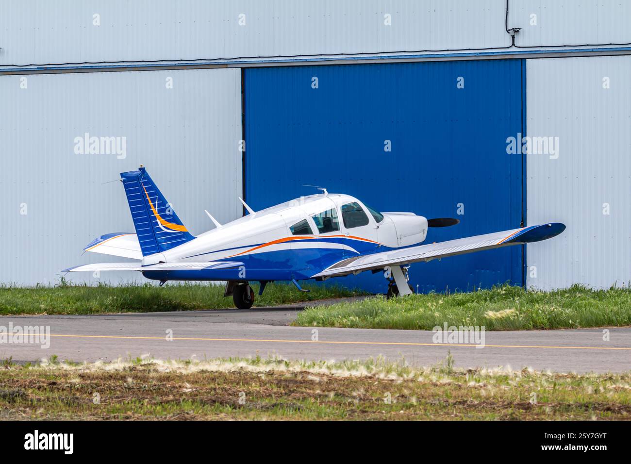 Private single piston engined airplane near aircraft hangar Stock Photo ...