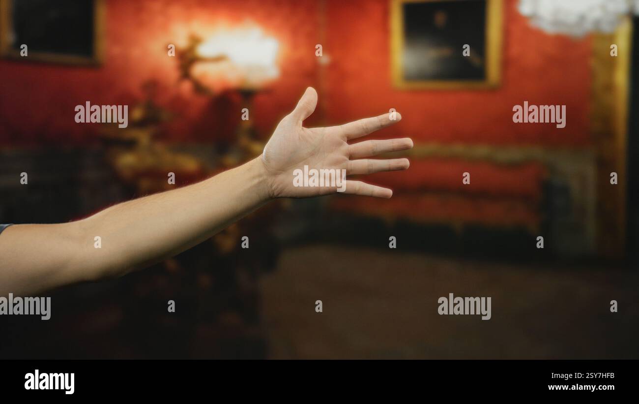 Man hand extending in elegant museum room with classic decor ...