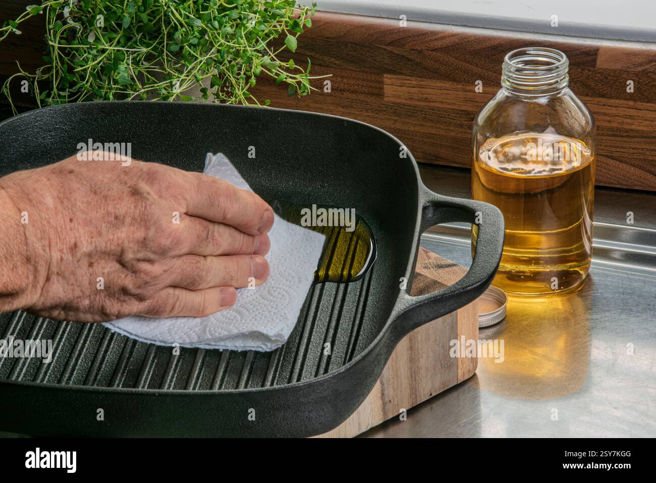 Seasoning a cast iron griddle pan with oil is a crucial technique to ...