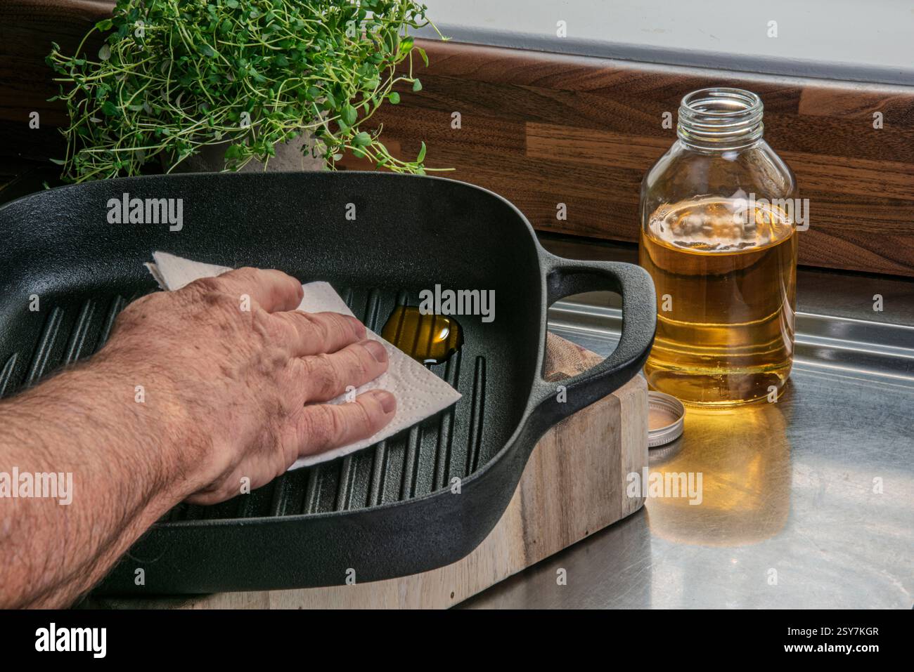 Seasoning a cast iron griddle pan with oil is a crucial technique to ...