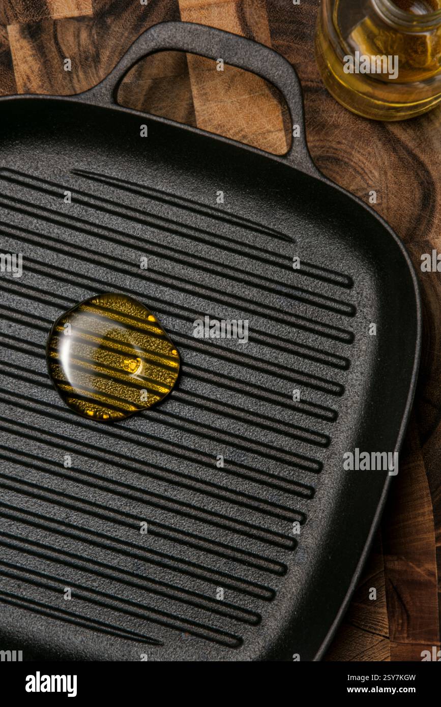 Seasoning a cast iron griddle pan with oil is a crucial technique to ...