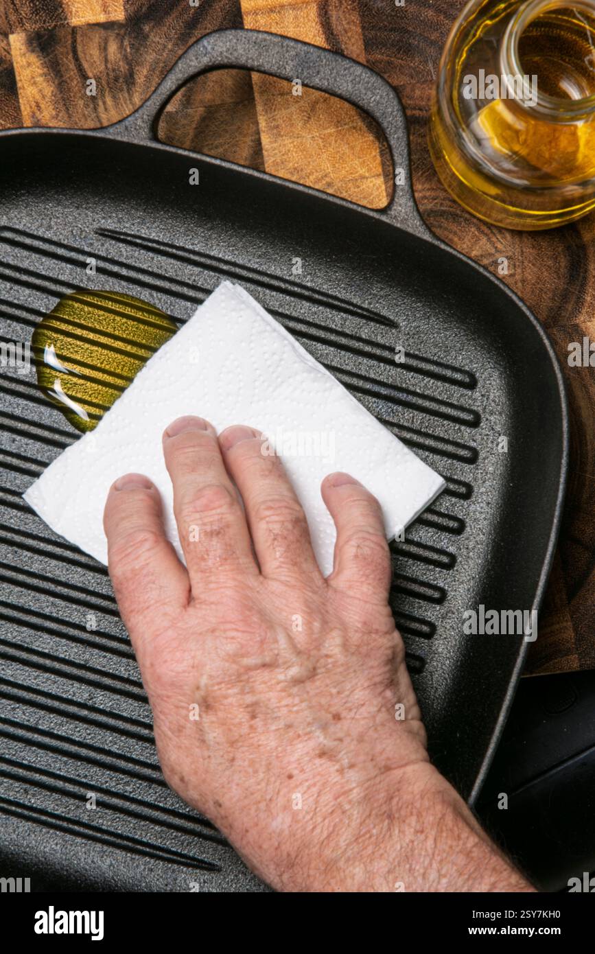 Seasoning a cast iron griddle pan with oil is a crucial technique to ...
