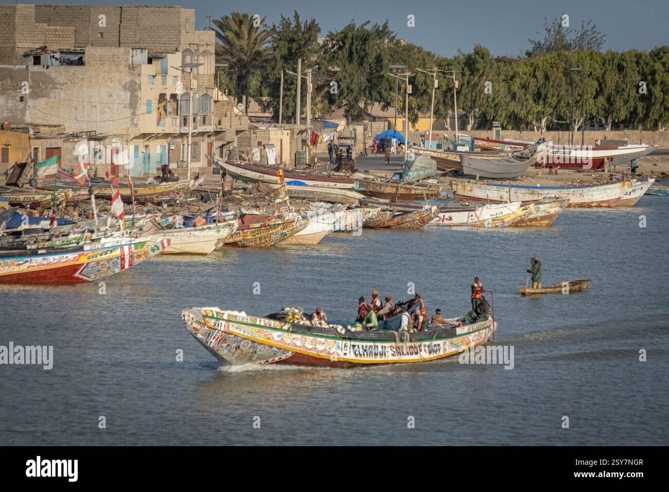 Fisherman in the boat catching fish with a nets in St. Louis, Senegal ...