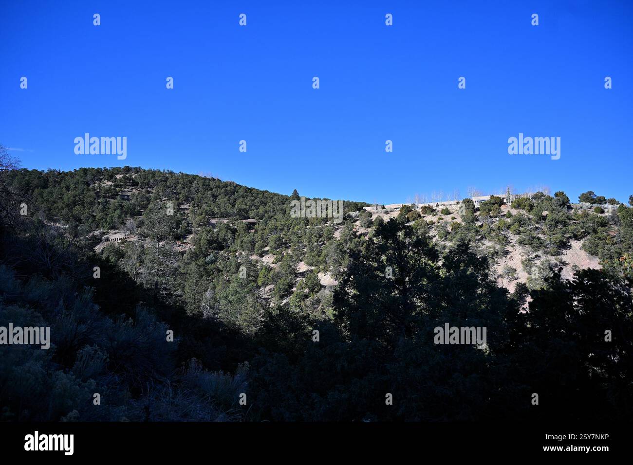 An exterior view shows a set of houses in the Santa Fe Summit community ...