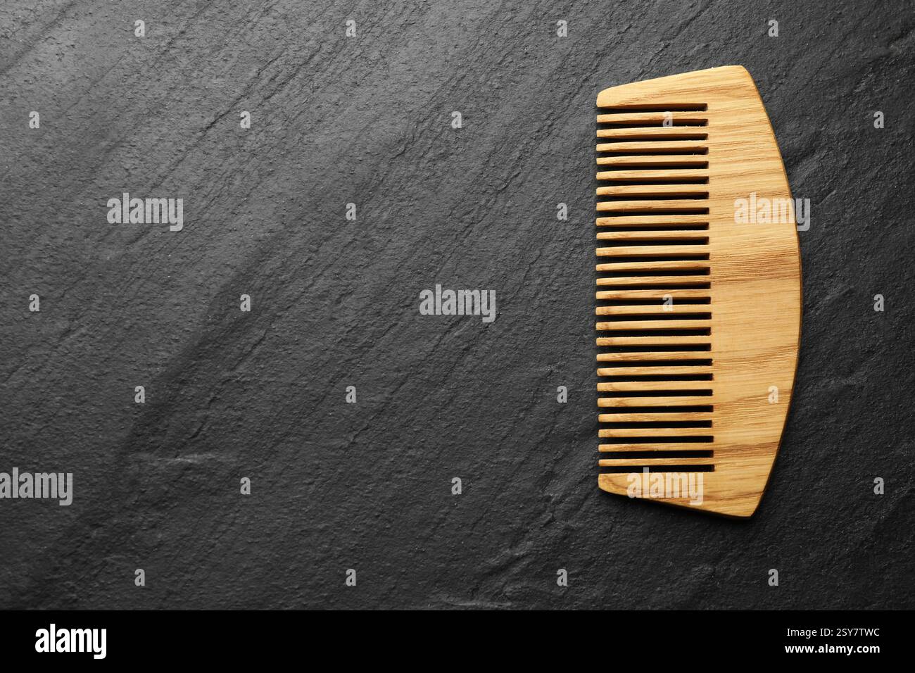 One wooden hair comb on grey background, top view. Space for text Stock ...