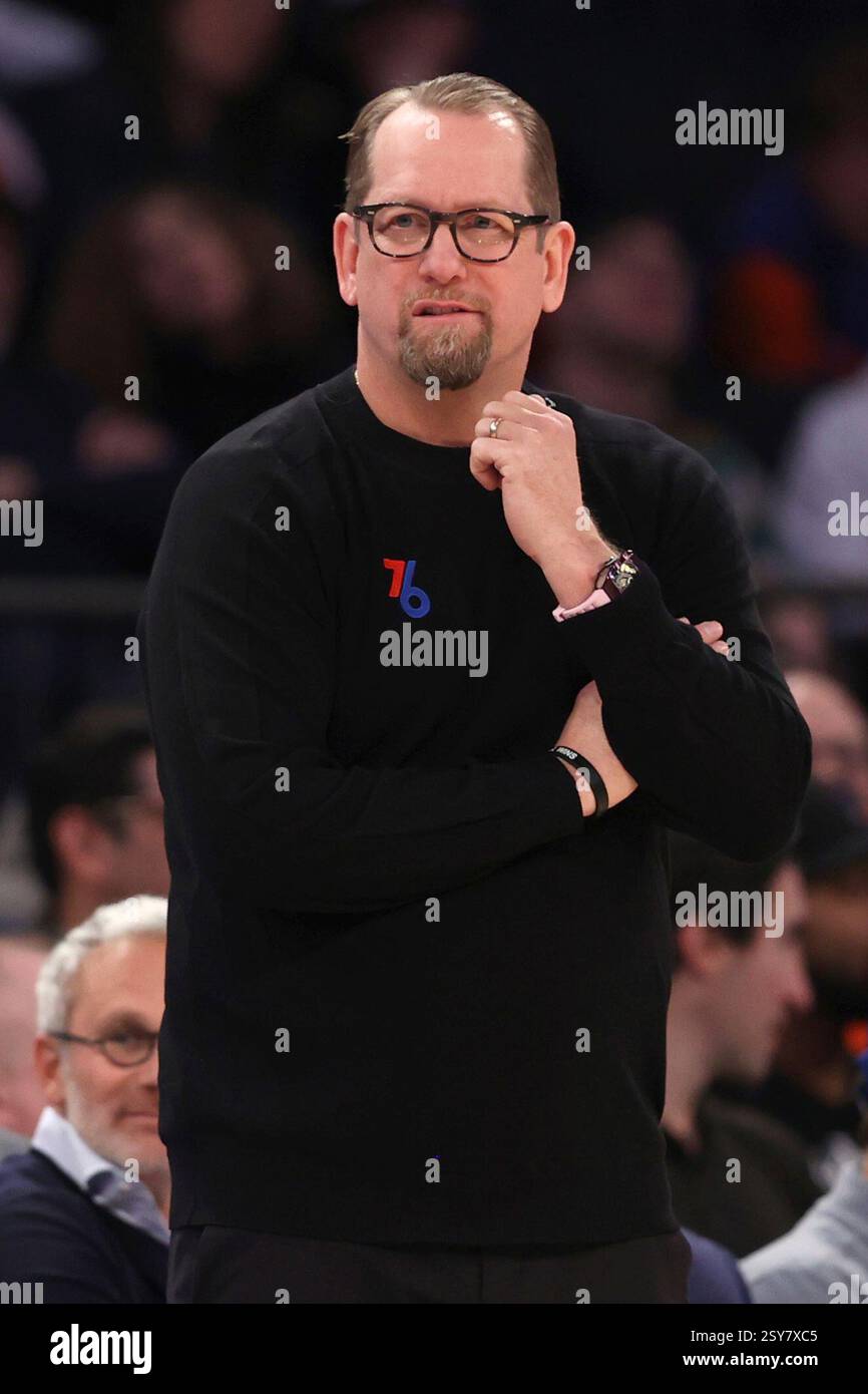 Philadelphia 76ers head coach Nick Nurse stands on the court during the ...
