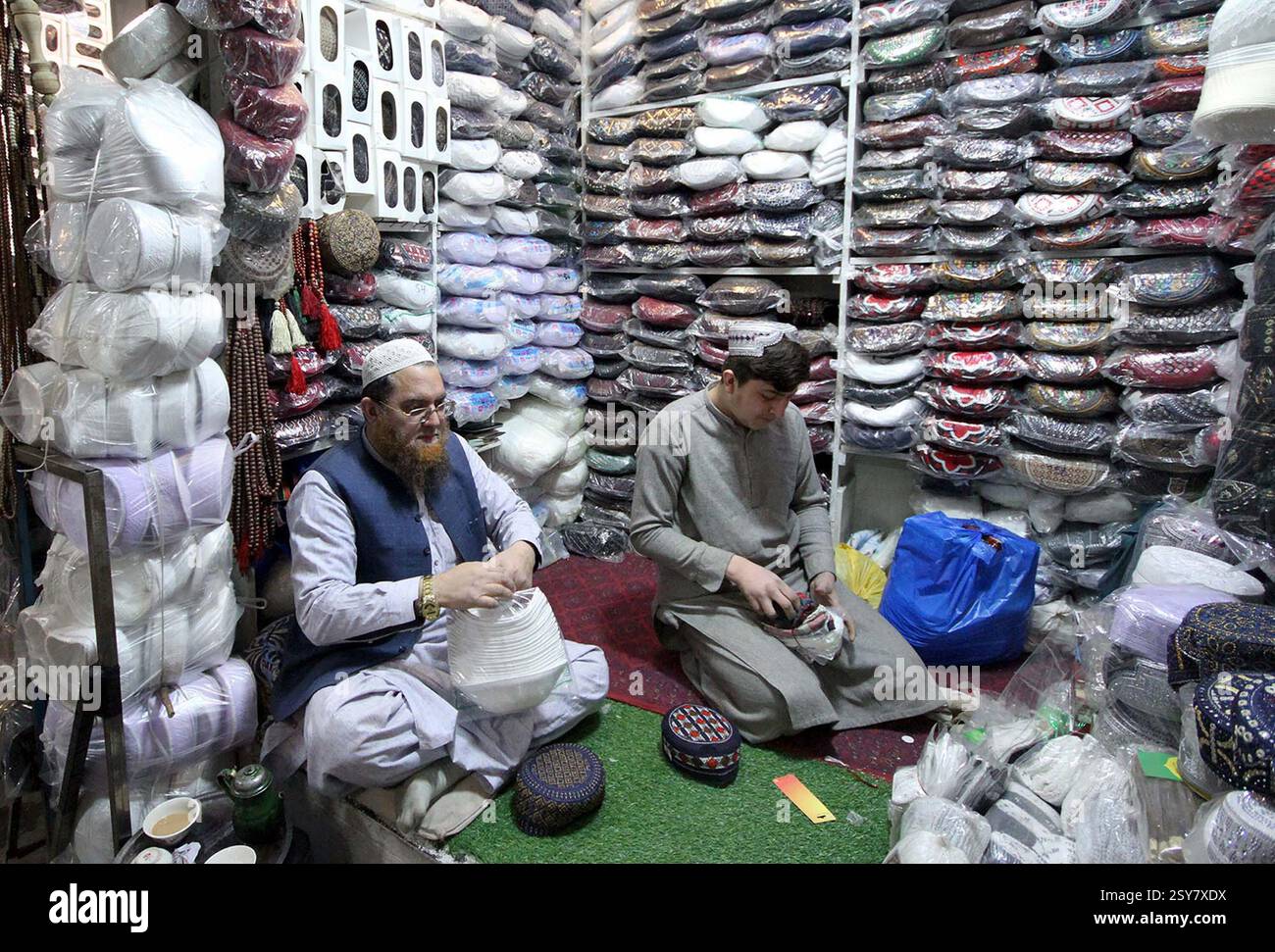 PESHAWAR, PAKISTAN, FEB 27: Prayer caps are being selling at a shop as ...