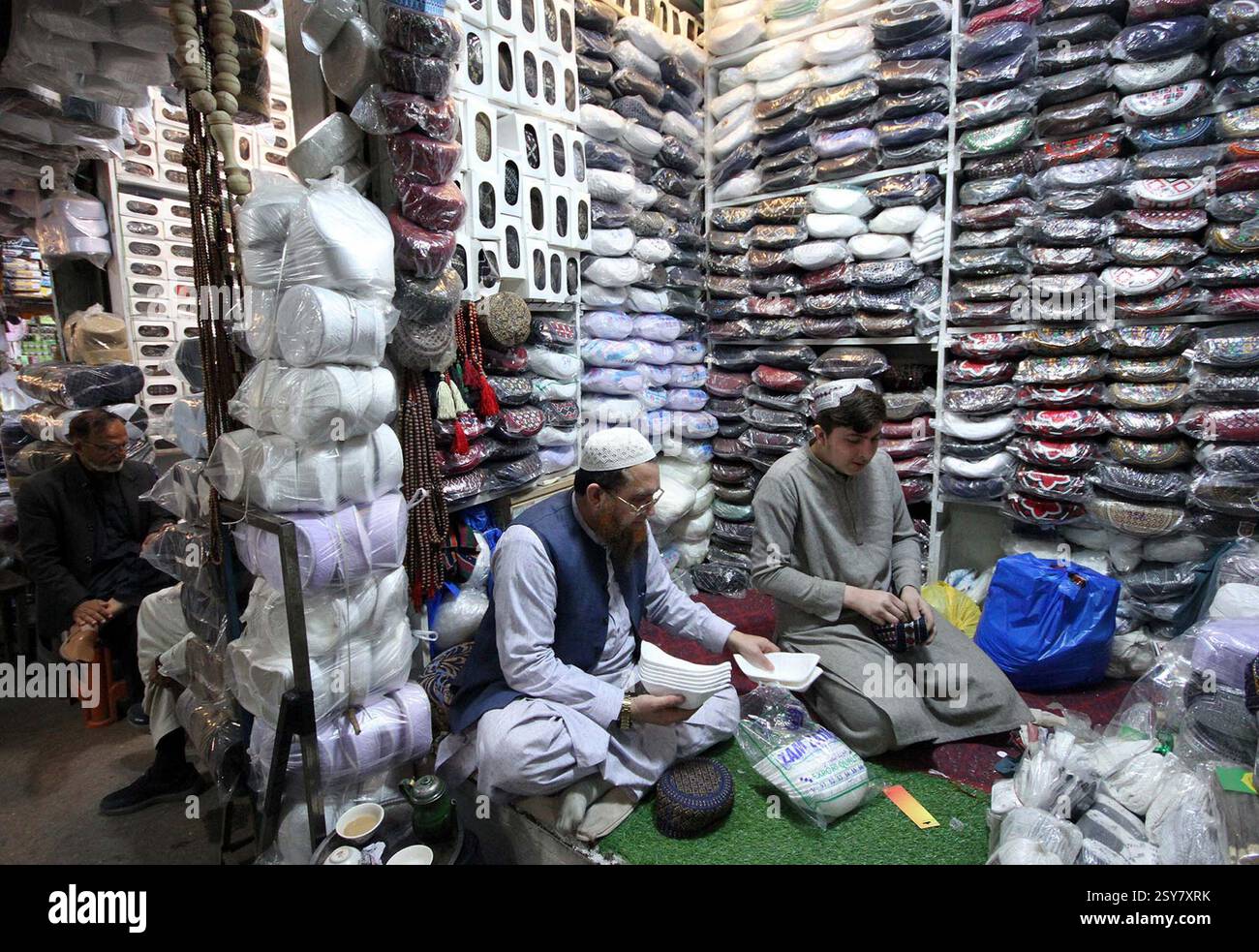 PESHAWAR, PAKISTAN, FEB 27: Prayer caps are being selling at a shop as ...
