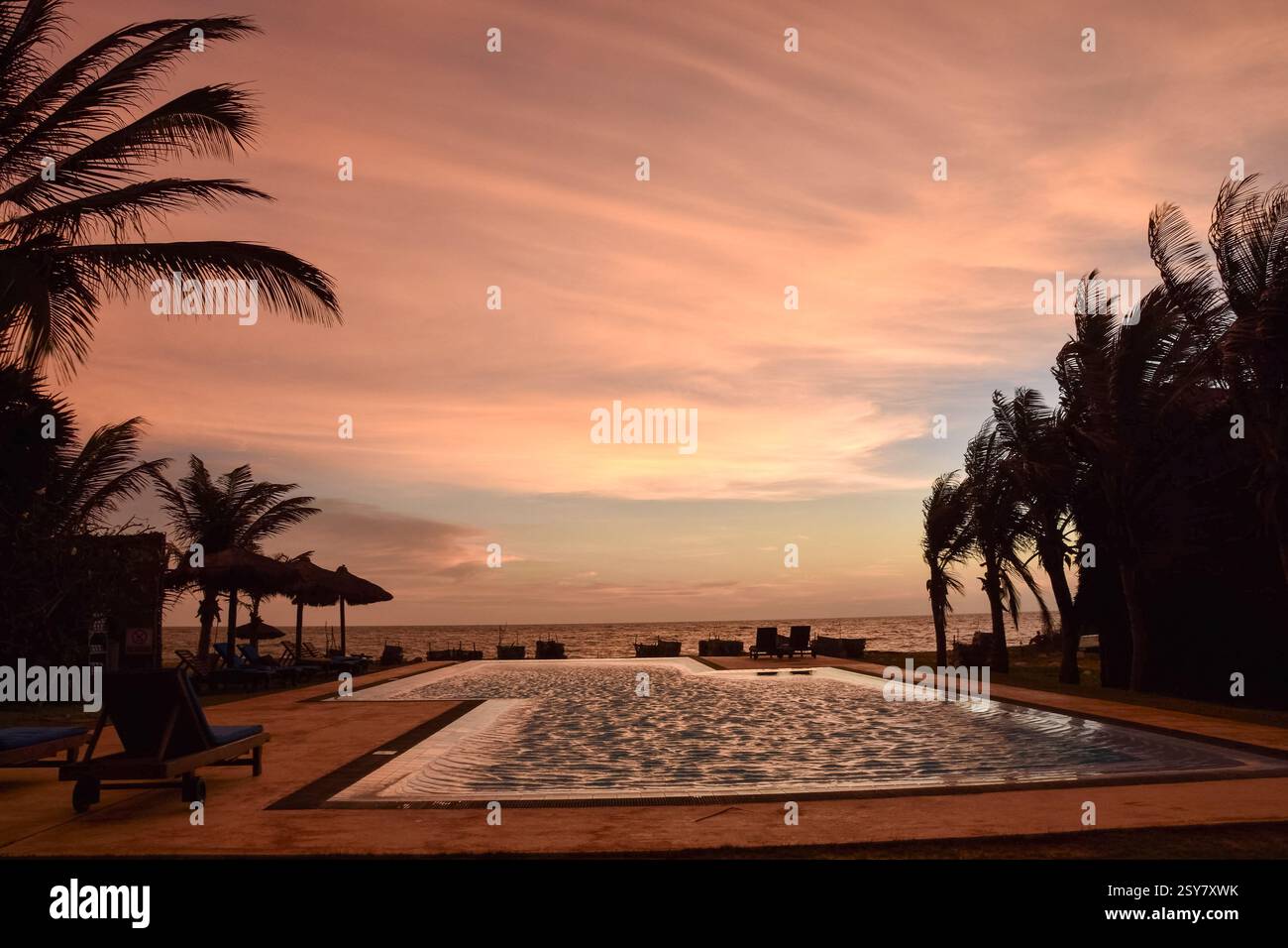 Beautiful sunset at the beach over a swimming pool in Palagama, Sri ...