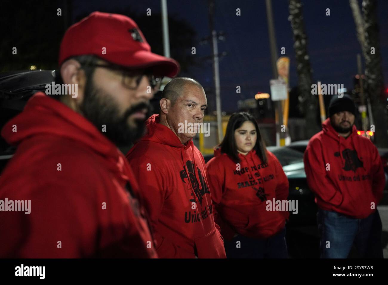 Ron Gochez, second from left, a teacher volunteering with Union del ...