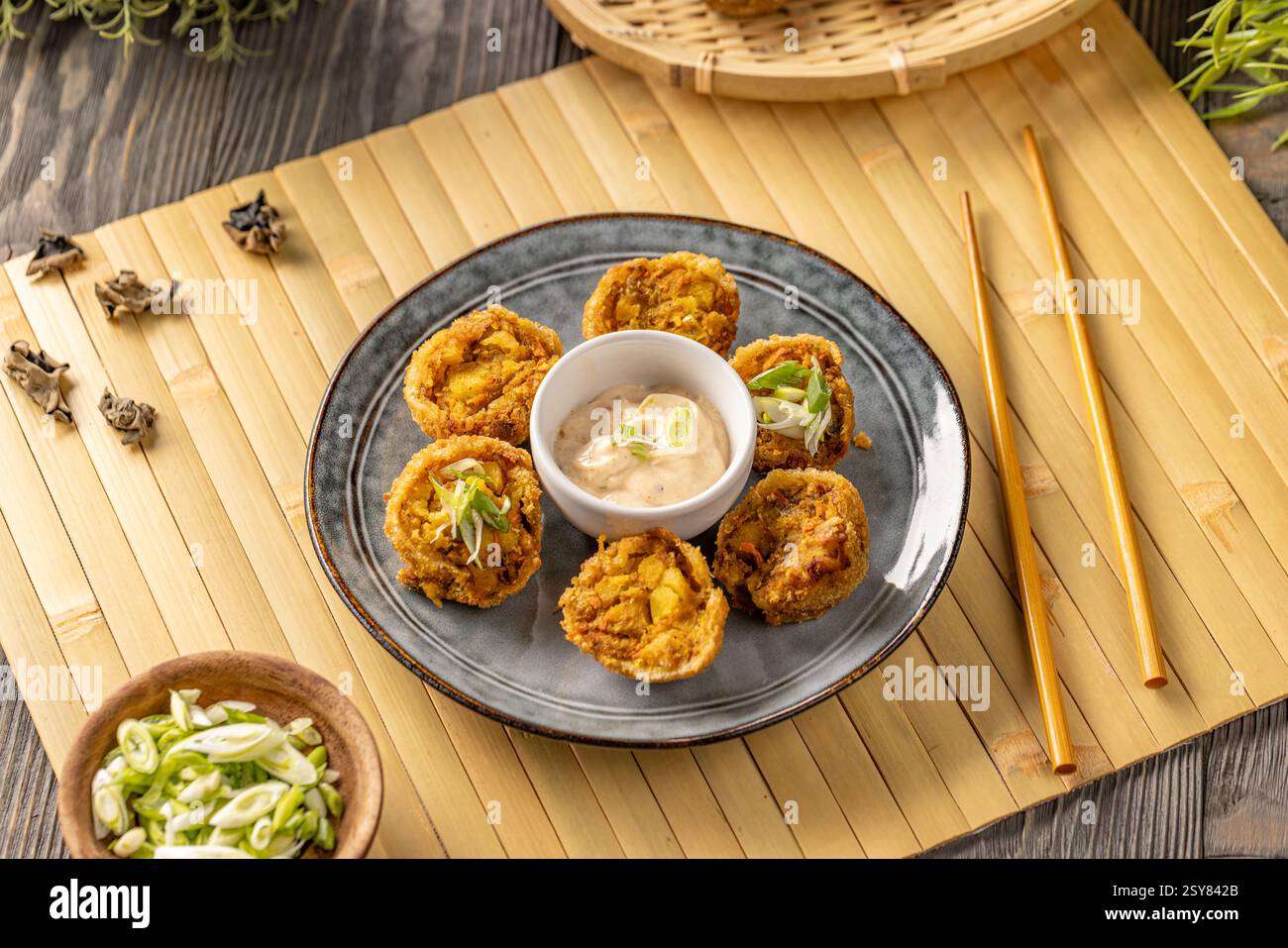 Delicious breaded shiitake mushroom balls are served with a dipping ...