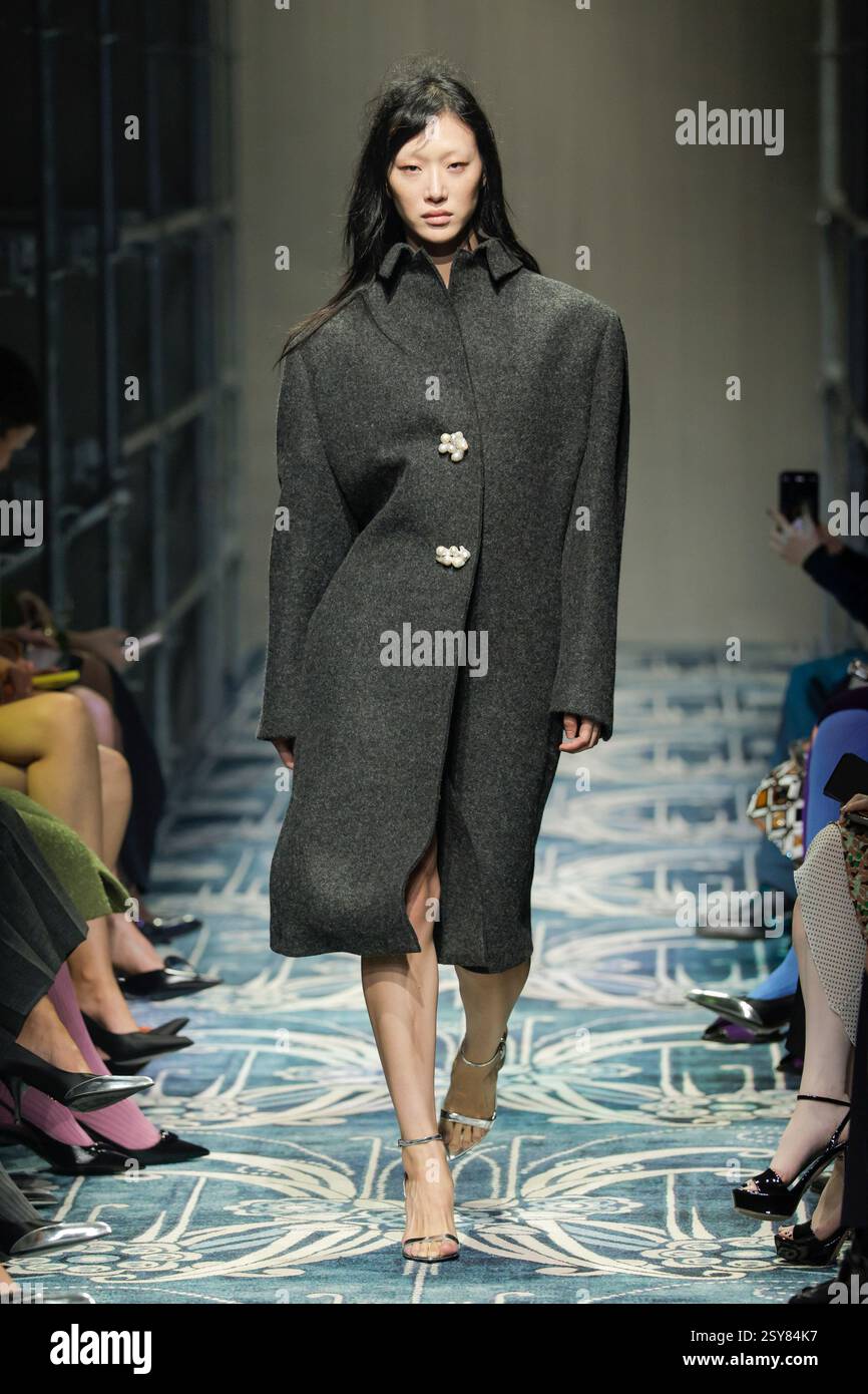 Milan, Italy. 27th Feb, 2025. Model Sora Choi walks on the runway ...