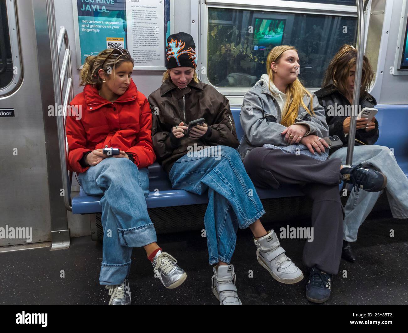 Distracted Gen Z travelers in the New York subway on Friday, February ...