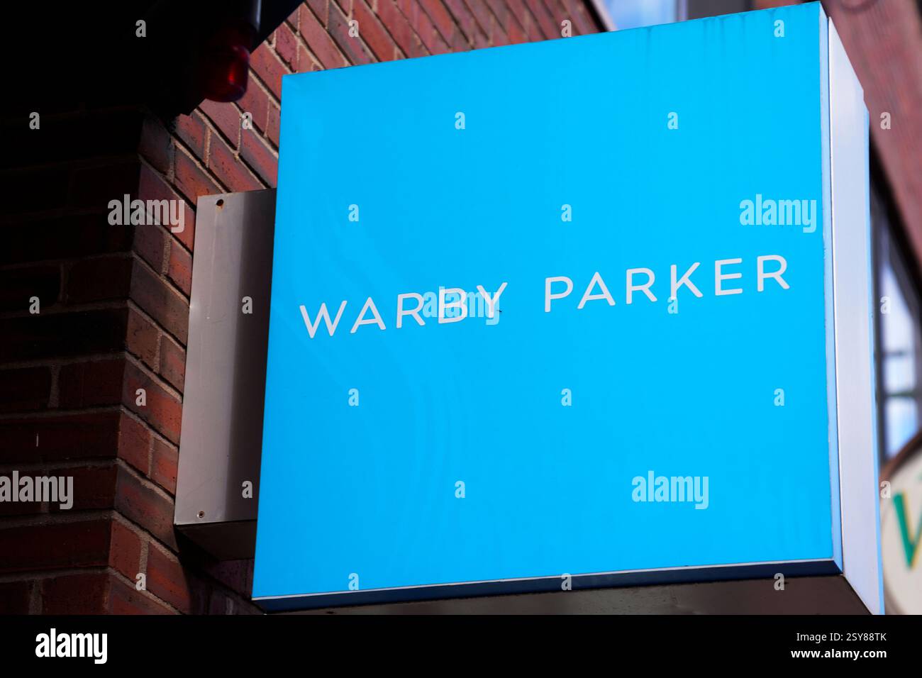 Sign outside a Warby Parker store, Wednesday, Feb. 26, 2025, in ...