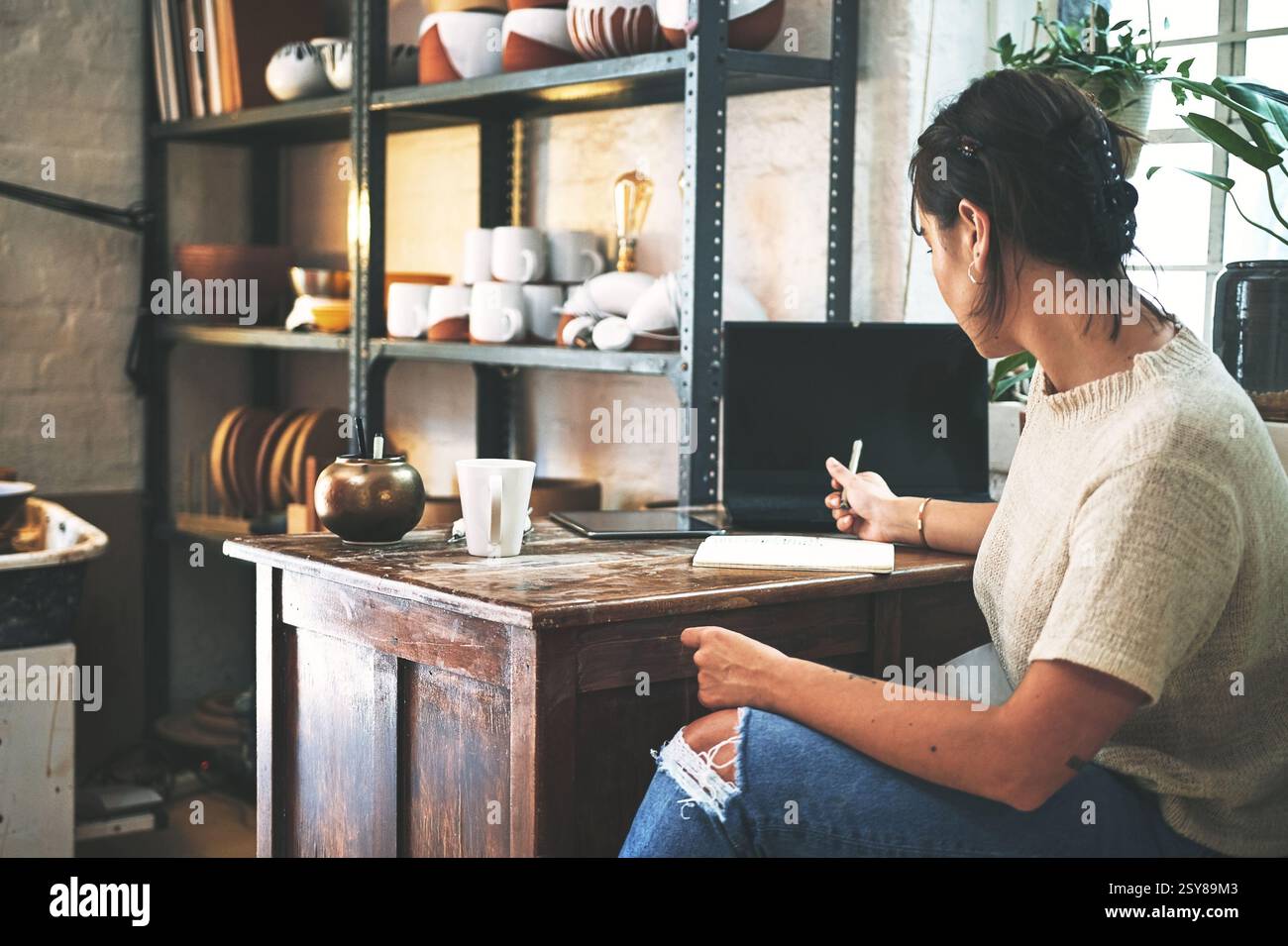 Pottery, planning and woman with notebook in workshop for inventory ...