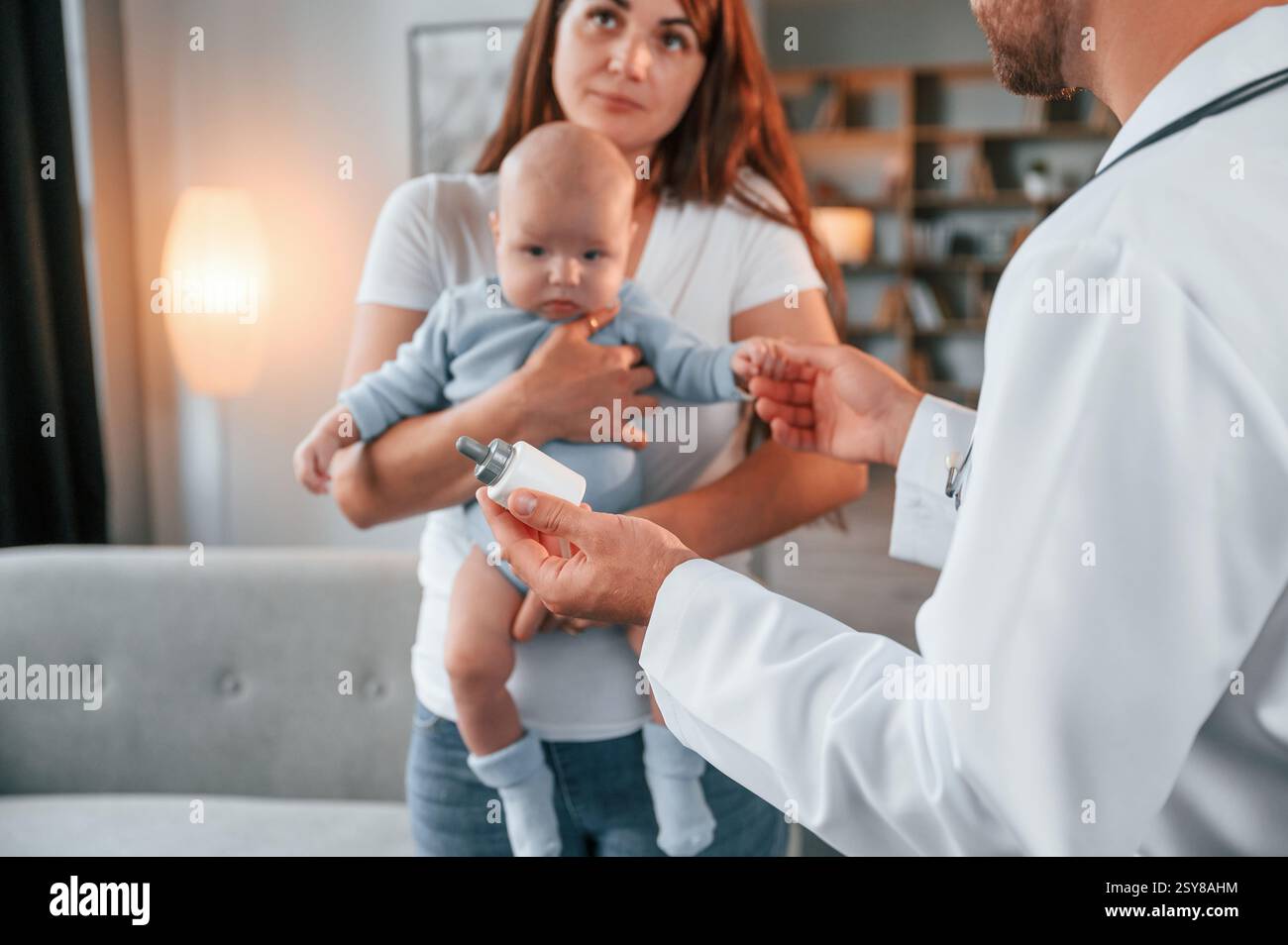Doctor taking cute little hi-res stock photography and images - Alamy