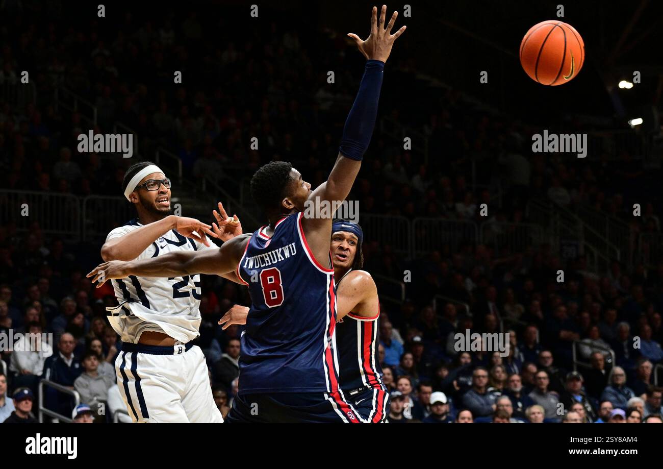 Butler center Andre Screen (23) passes the ball away from St. John's ...