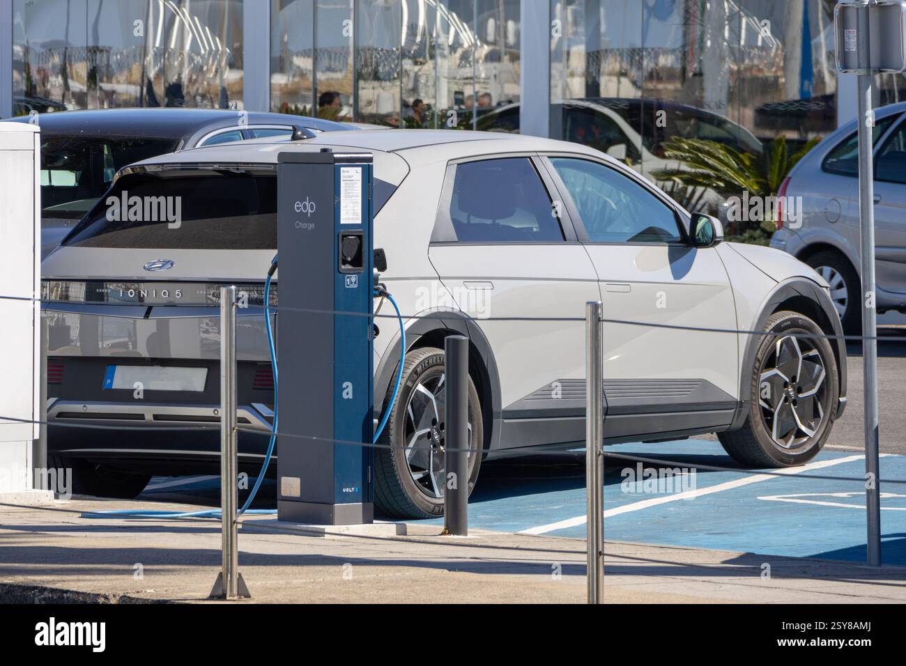Modern electric car, hyundai ioniq 6, charging at a public charging ...