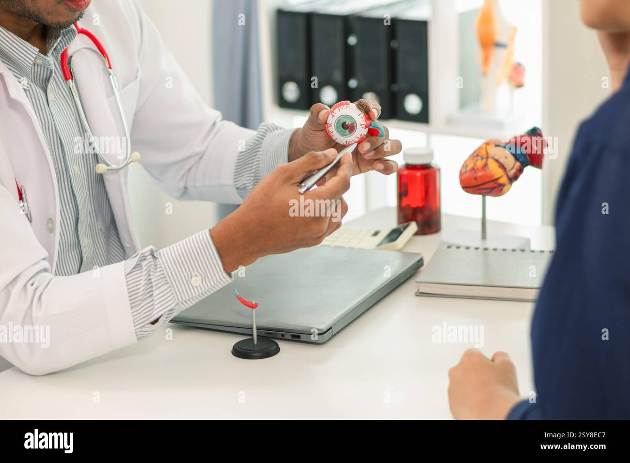 ophthalmologist is examining the patient's eye abnormalities to correct ...