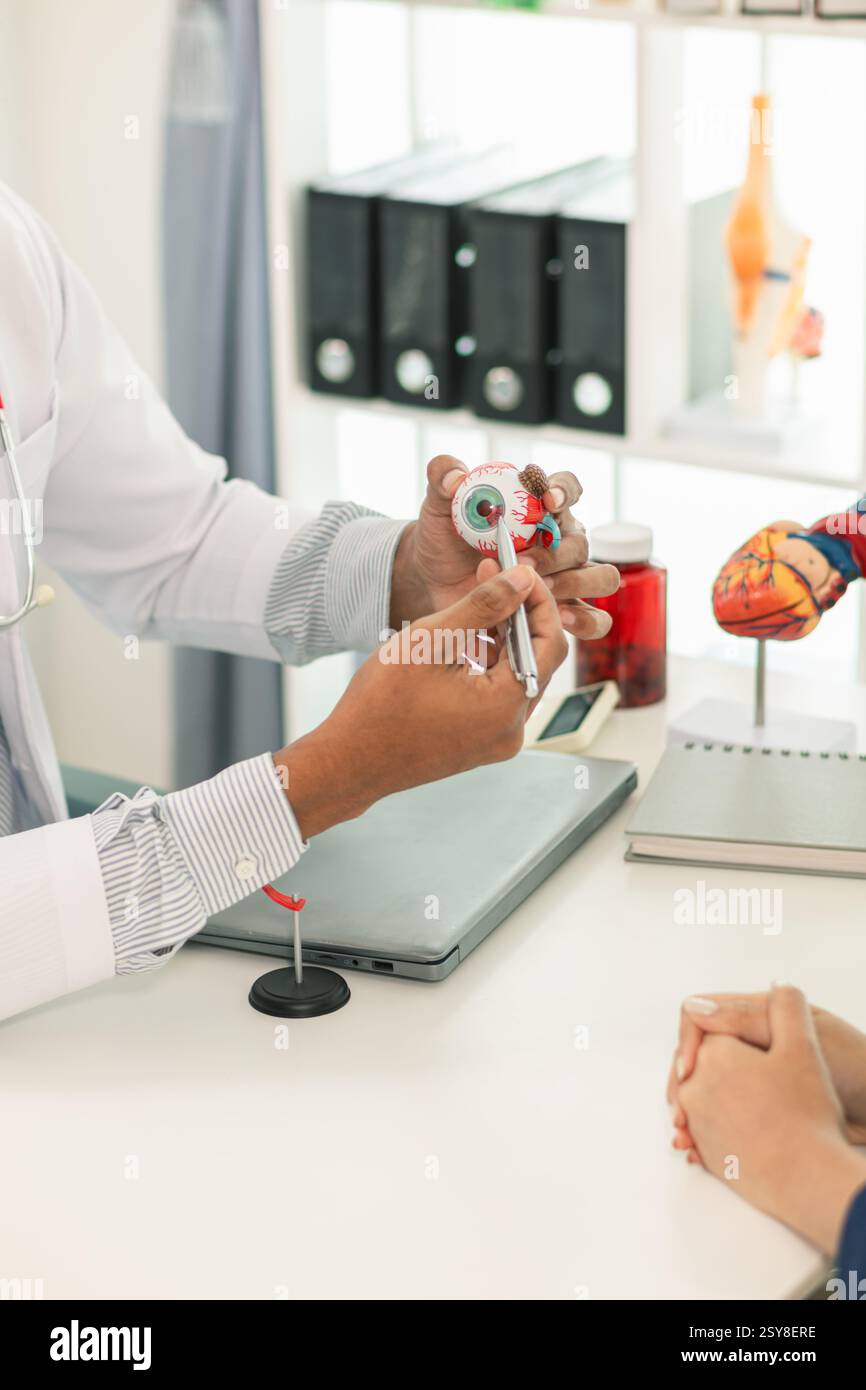 ophthalmologist is examining the patient's eye abnormalities to correct ...