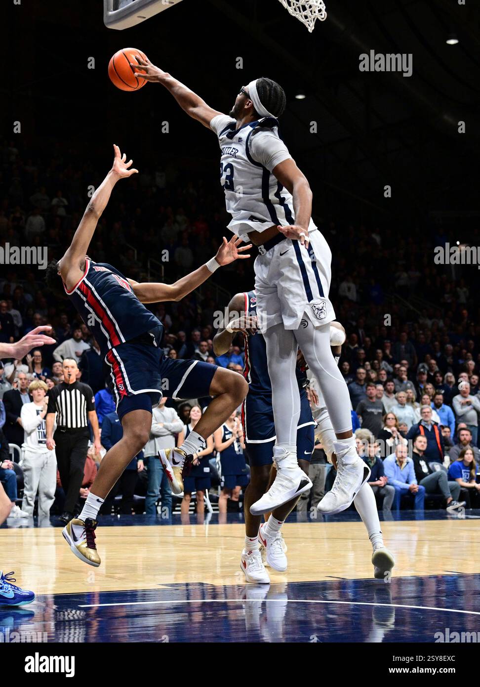 Butler center Andre Screen (23) swats away a shot by St. John's guard ...