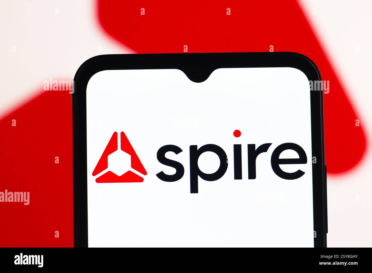 In this photo illustration, the Spire Global logo is seen displayed on a smartphone screen Stock ...
