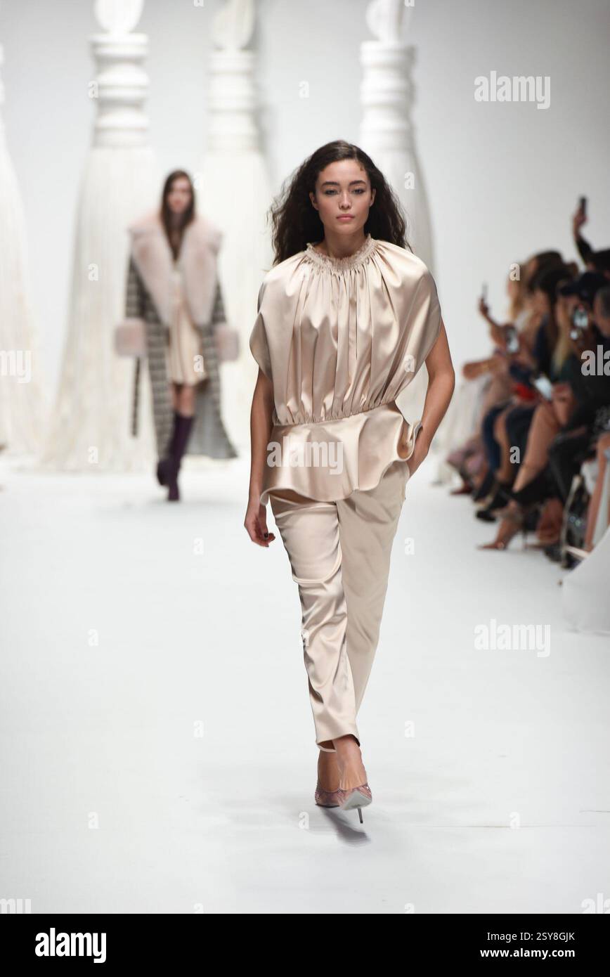 Milan, Italy. 27th Feb, 2025. Models walks the runway at the Genny ...