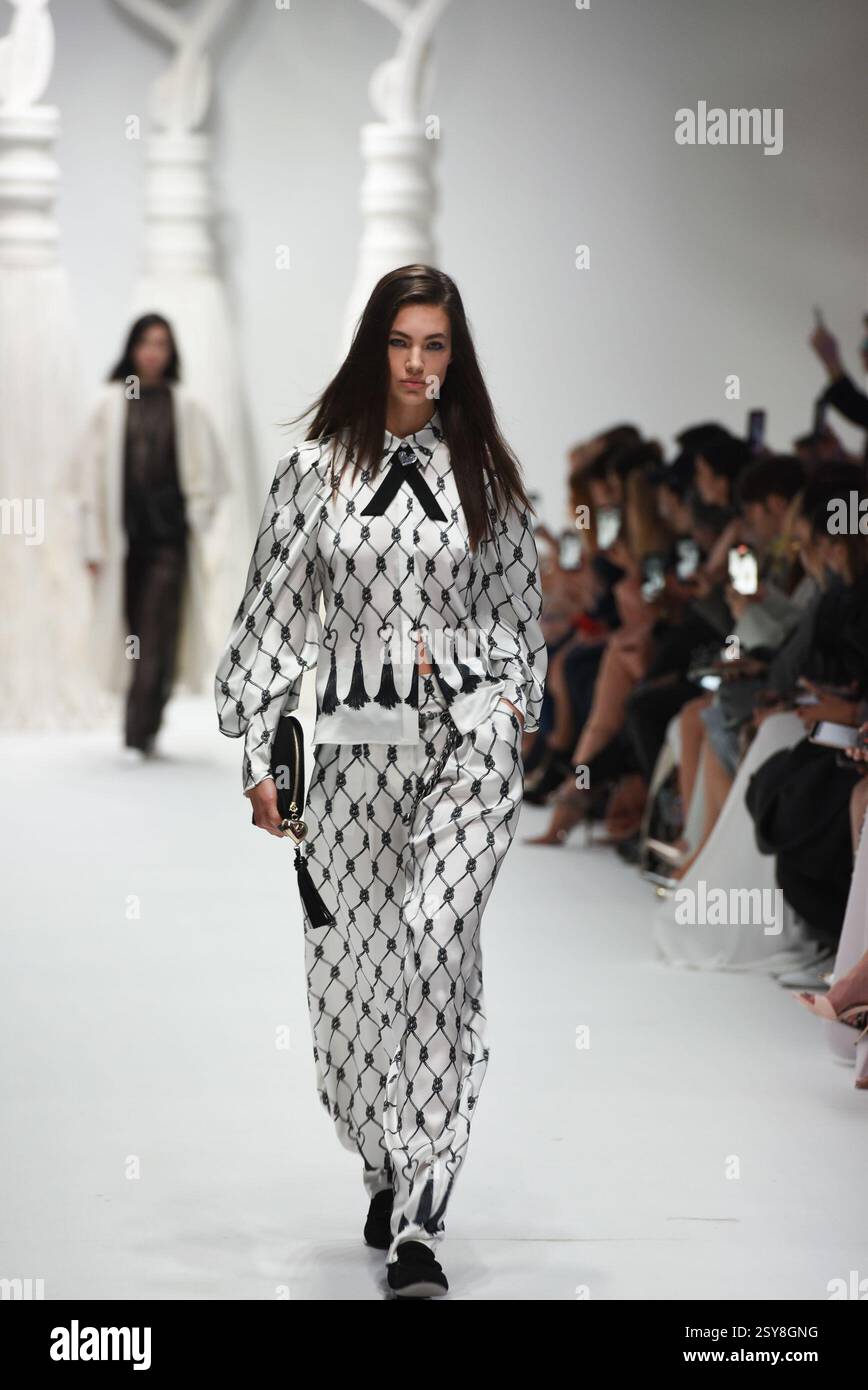 Milan, Italy. 27th Feb, 2025. Models walks the runway at the Genny ...