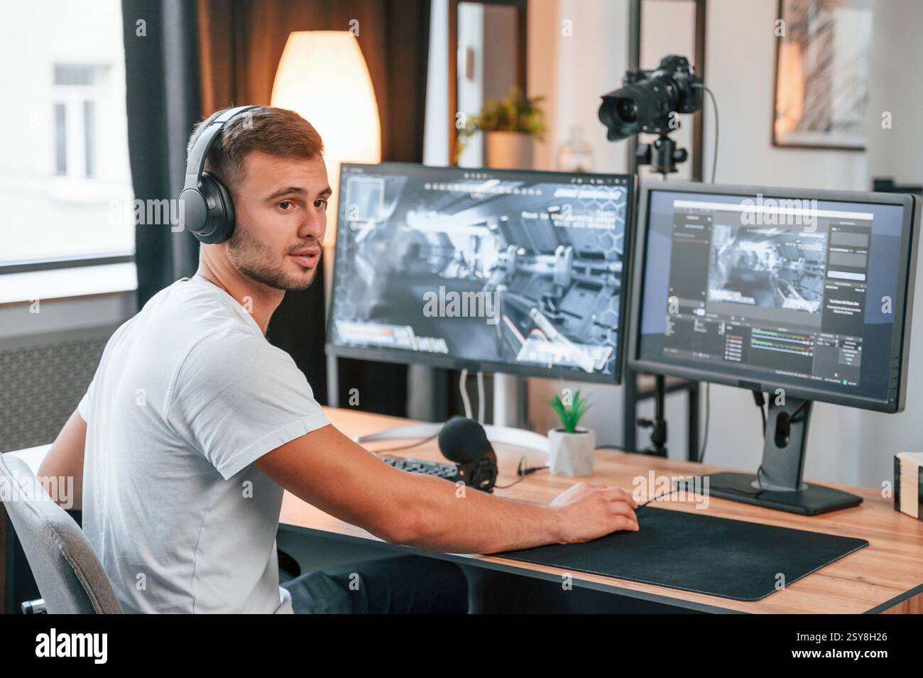 Process of recording. Young man playing and streaming the first person ...