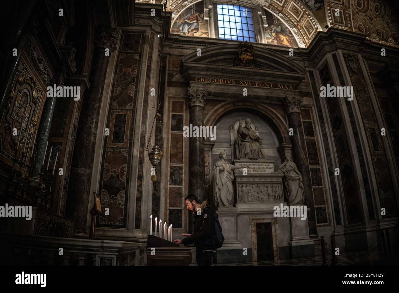 Vatican City, Vatican. 27th Feb, 2025. A tourist lights an electric ...