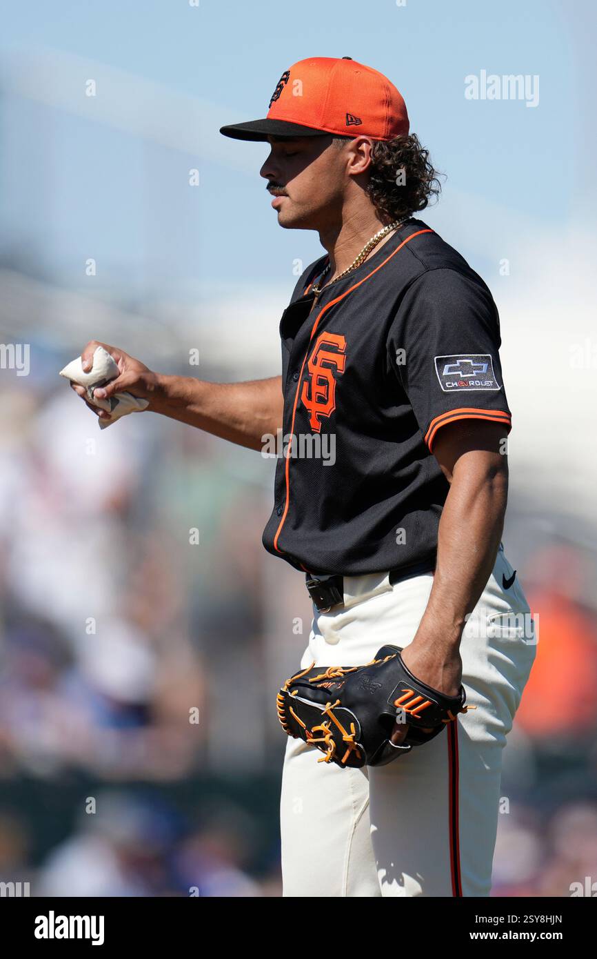 San Francisco Giants starting pitcher Jordan Hicks squeezes the rosin ...