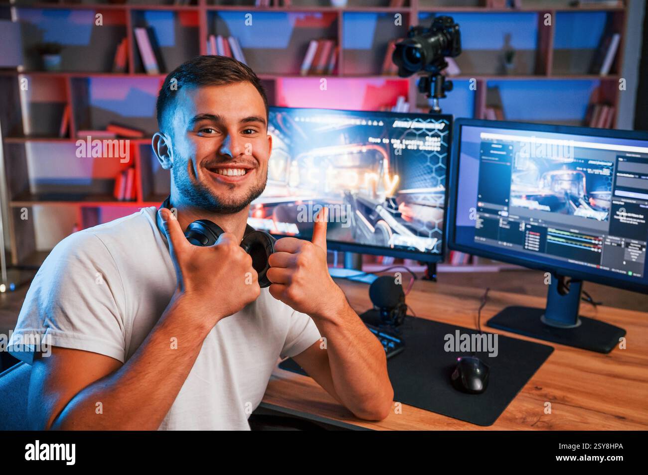 Male game streamer in casual clothes is indoors with pc Stock Photo - Alamy