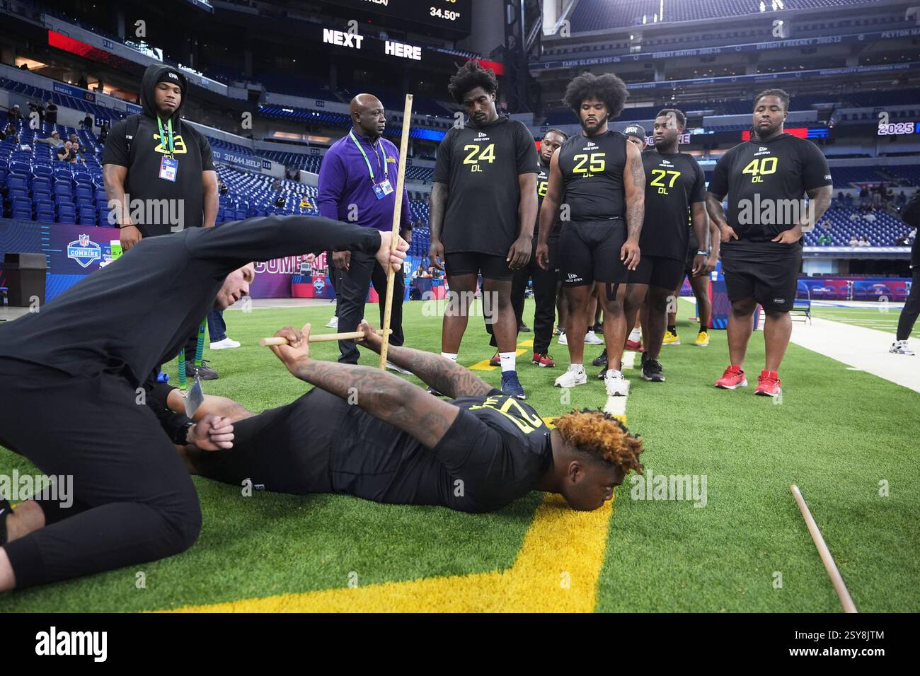 Florida defensive lineman Cam Jackson is measured at the NFL football ...