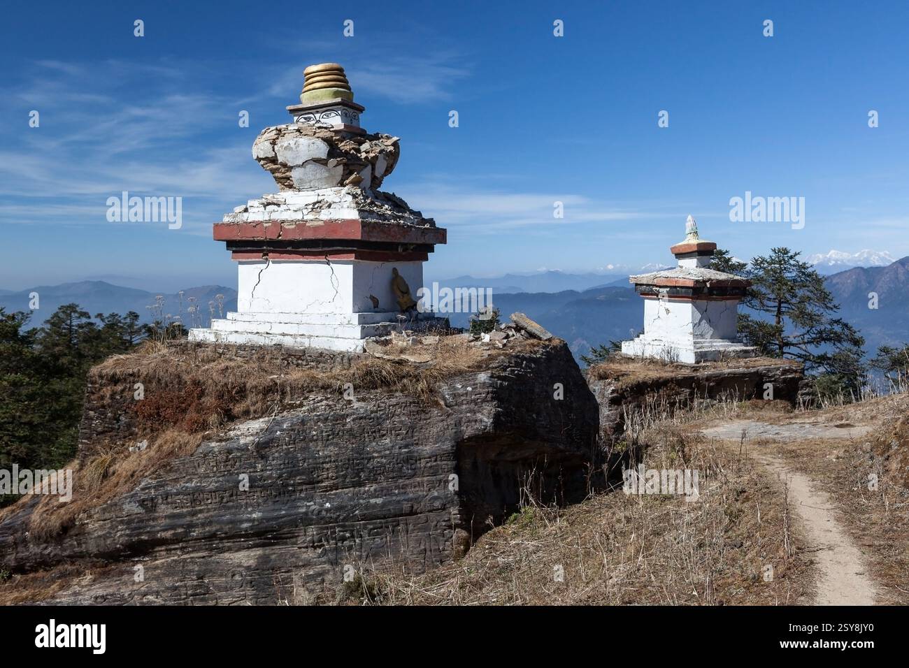 Buddhist stupas in remote village in Himalayas with high rocky ...