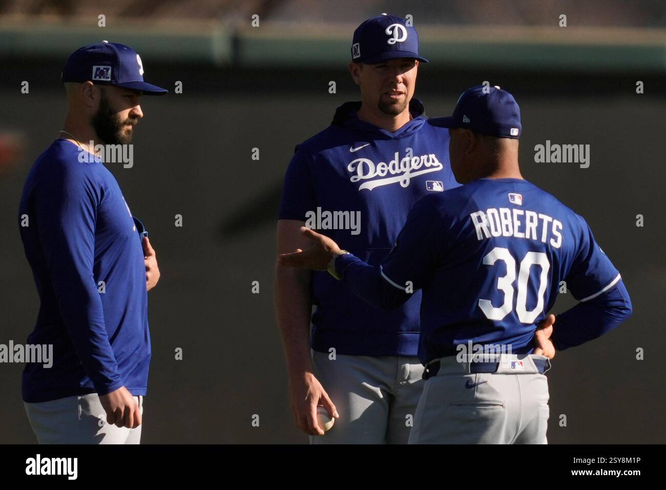 Los Angeles Dodgers manager Dave Roberts (30) talks with relief pitcher ...