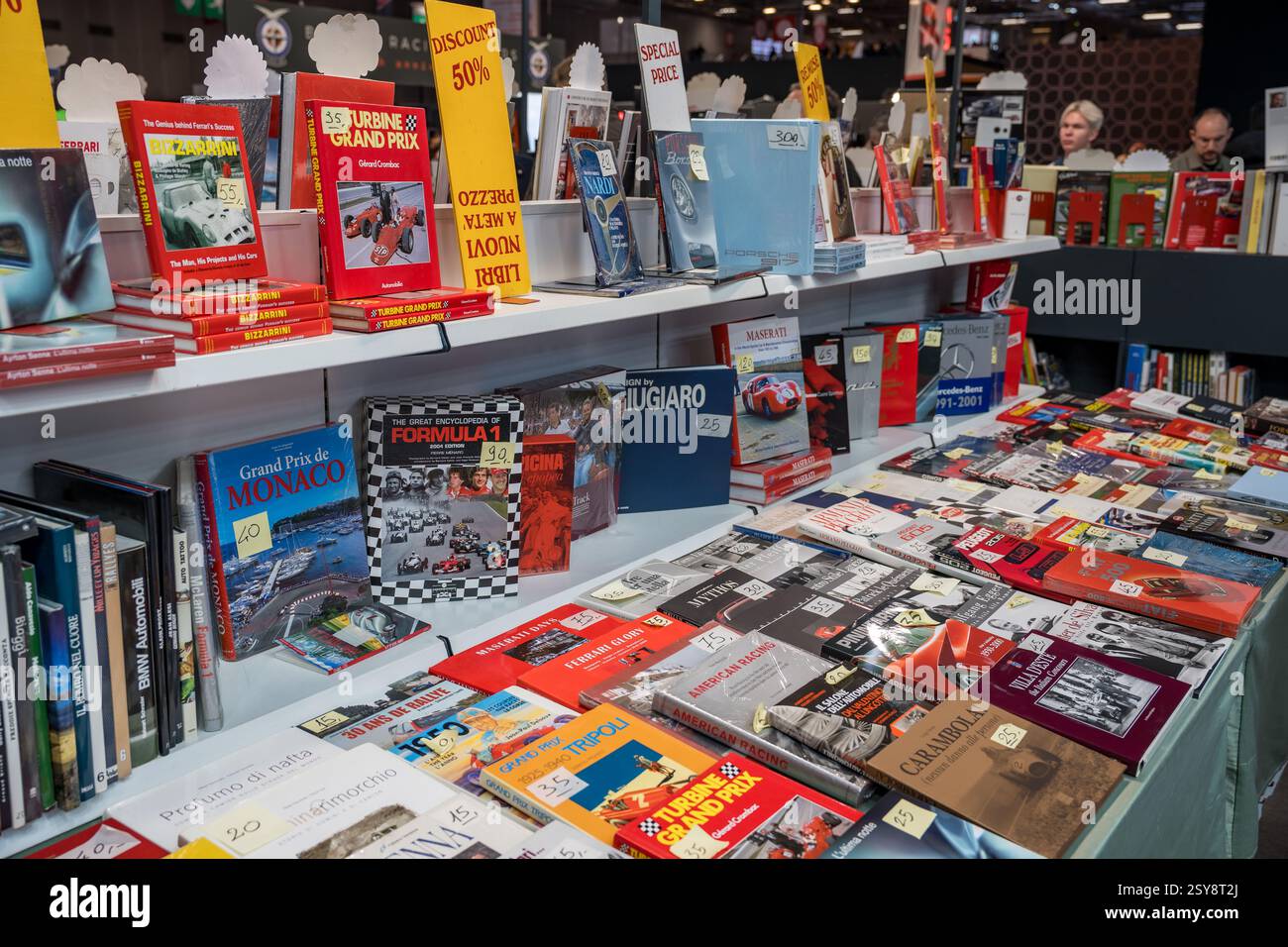 Colorful assortment of racing books displayed at a vibrant book fair in ...