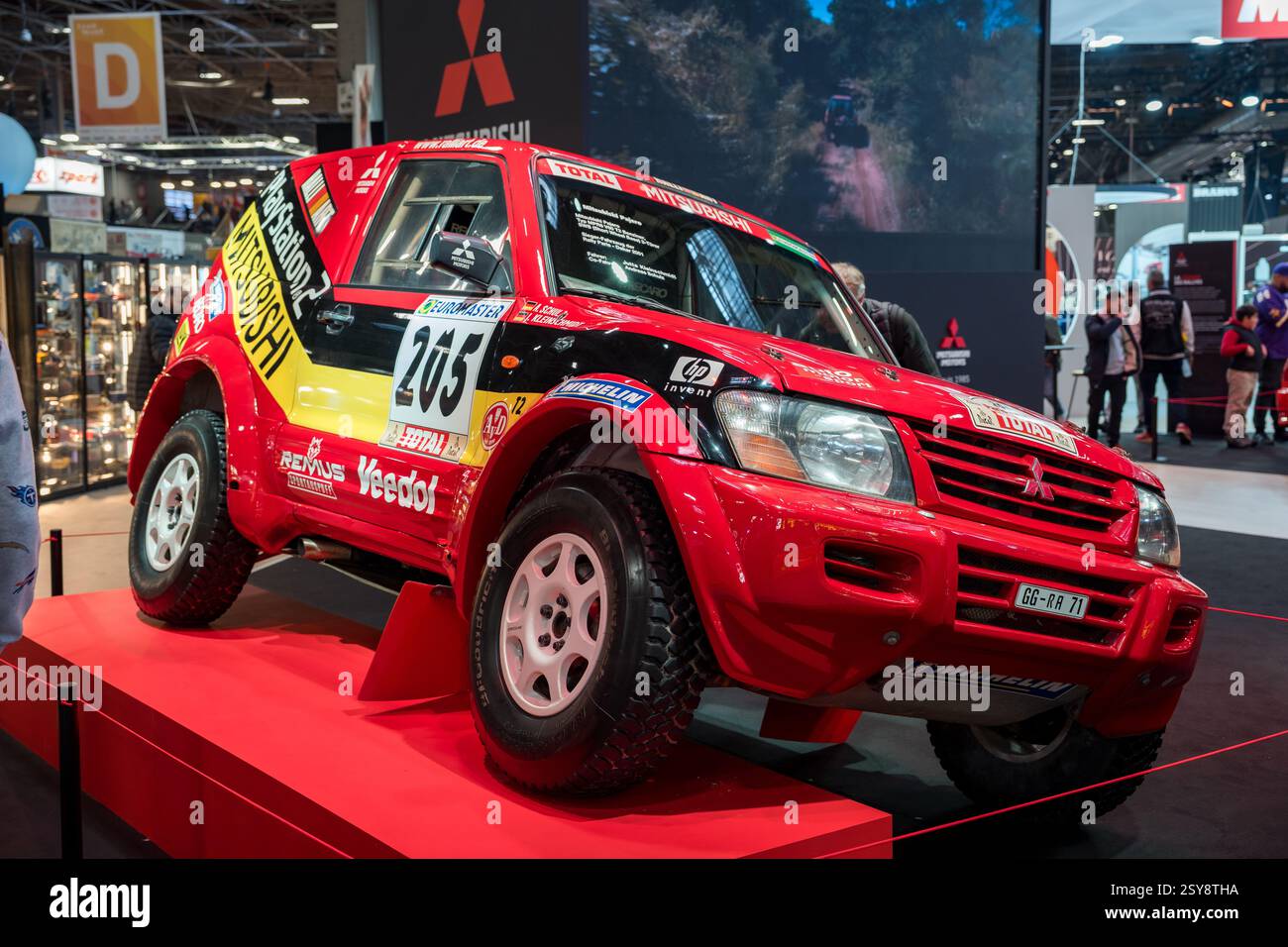 Legendary rally car on display at an automotive expo featuring ...
