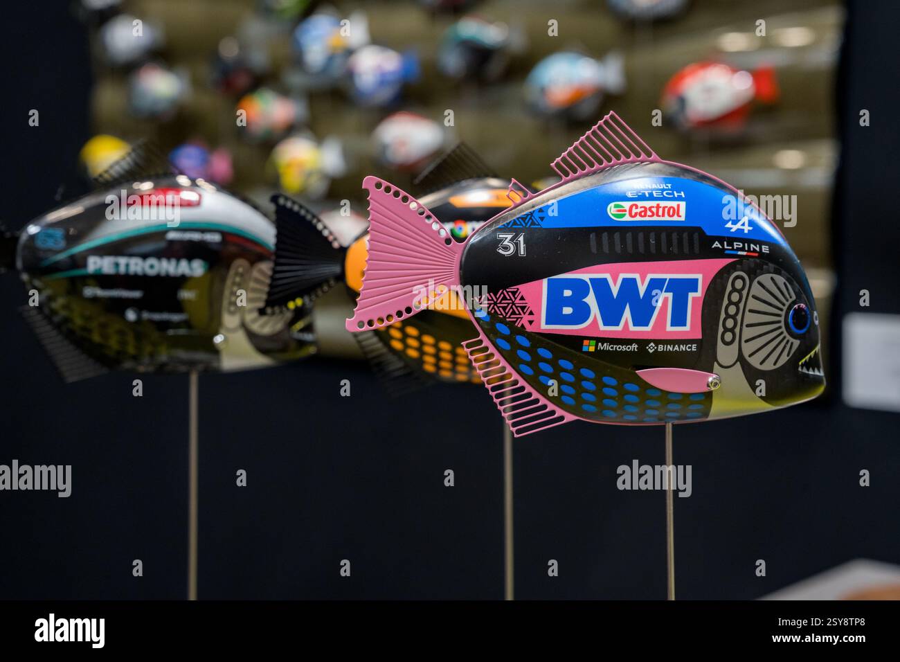 Unique fish models inspired by racing teams displayed at an art ...
