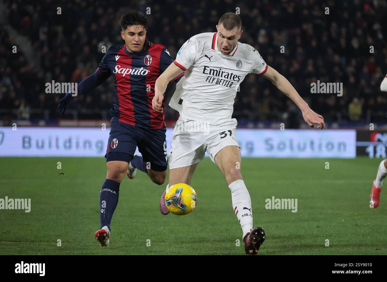 Bologna, Italia. 27th Feb, 2025. Bologna's Santiago Castro fights for the ball with MilanÕs ...