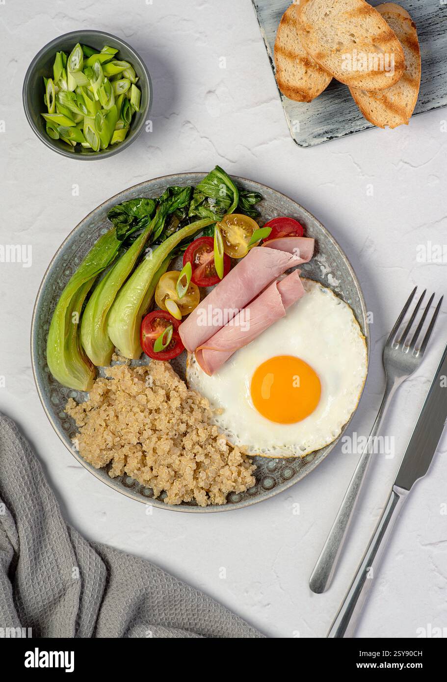Food photography of balanced breakfast, fried egg with quinoa, bok choy ...