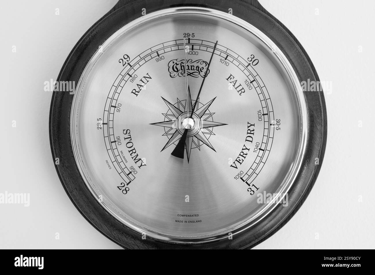 Close up of an aneroid barometer mounted on a wall Stock Photo - Alamy
