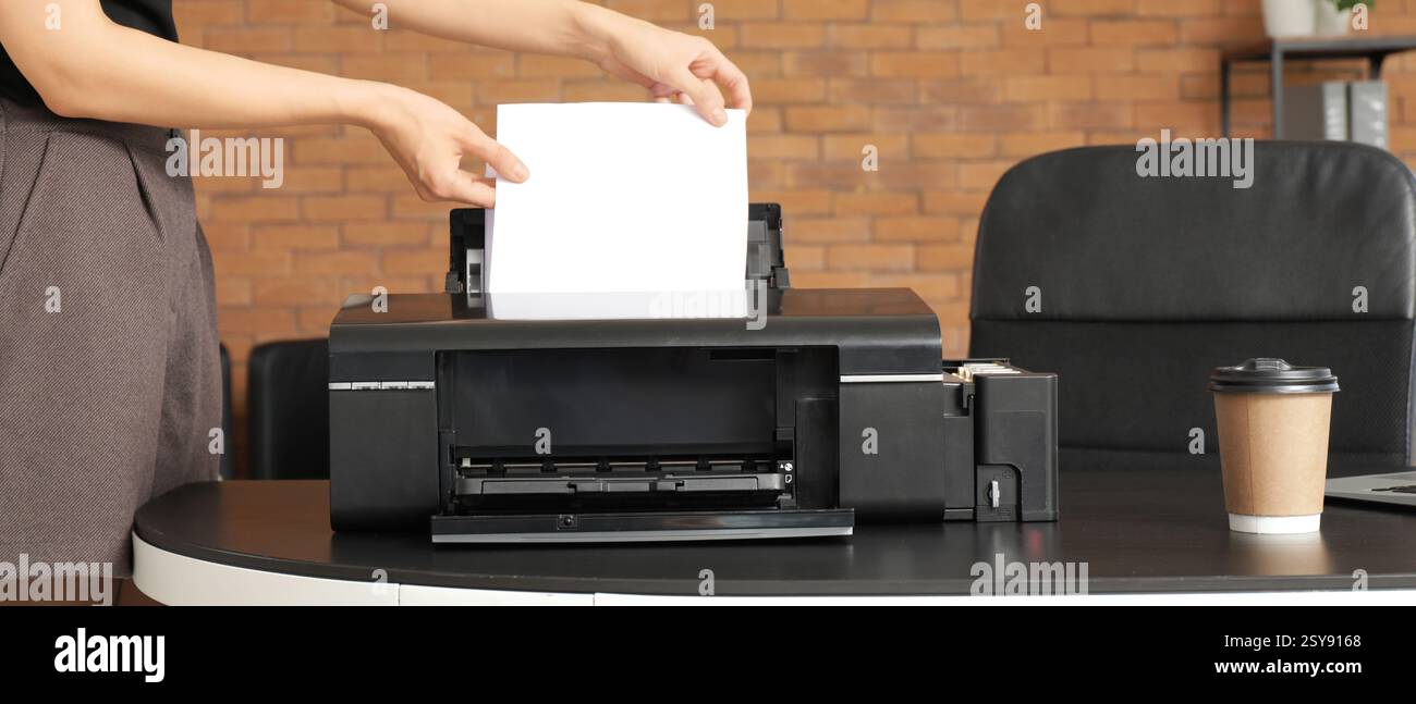 Businesswoman using photocopier hi-res stock photography and images - Alamy